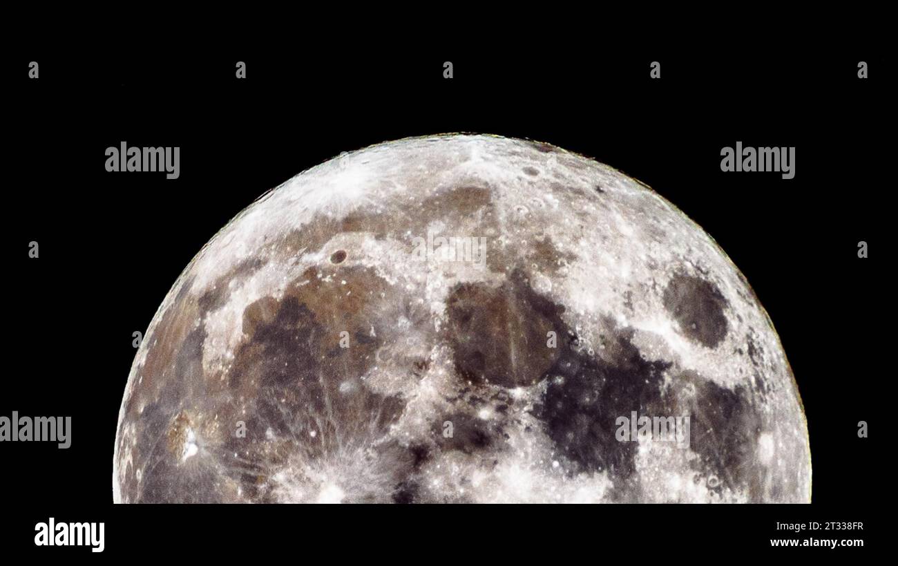 A full moon illuminated against a dark background Stock Photo - Alamy