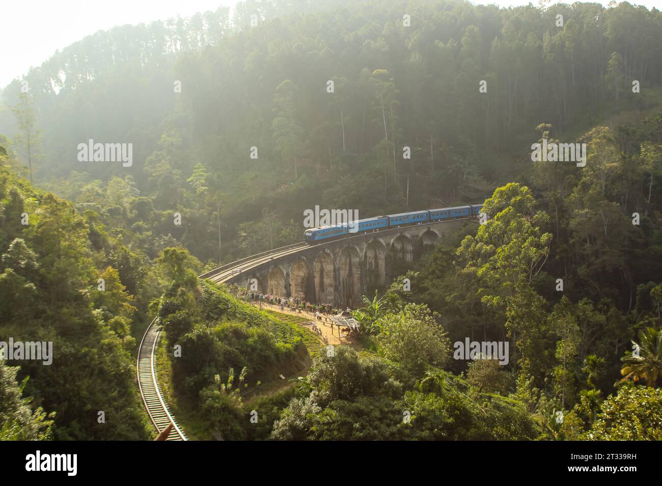 Train crosses Demodara nine arch bridge. Sri Lanka. Aerial background ...