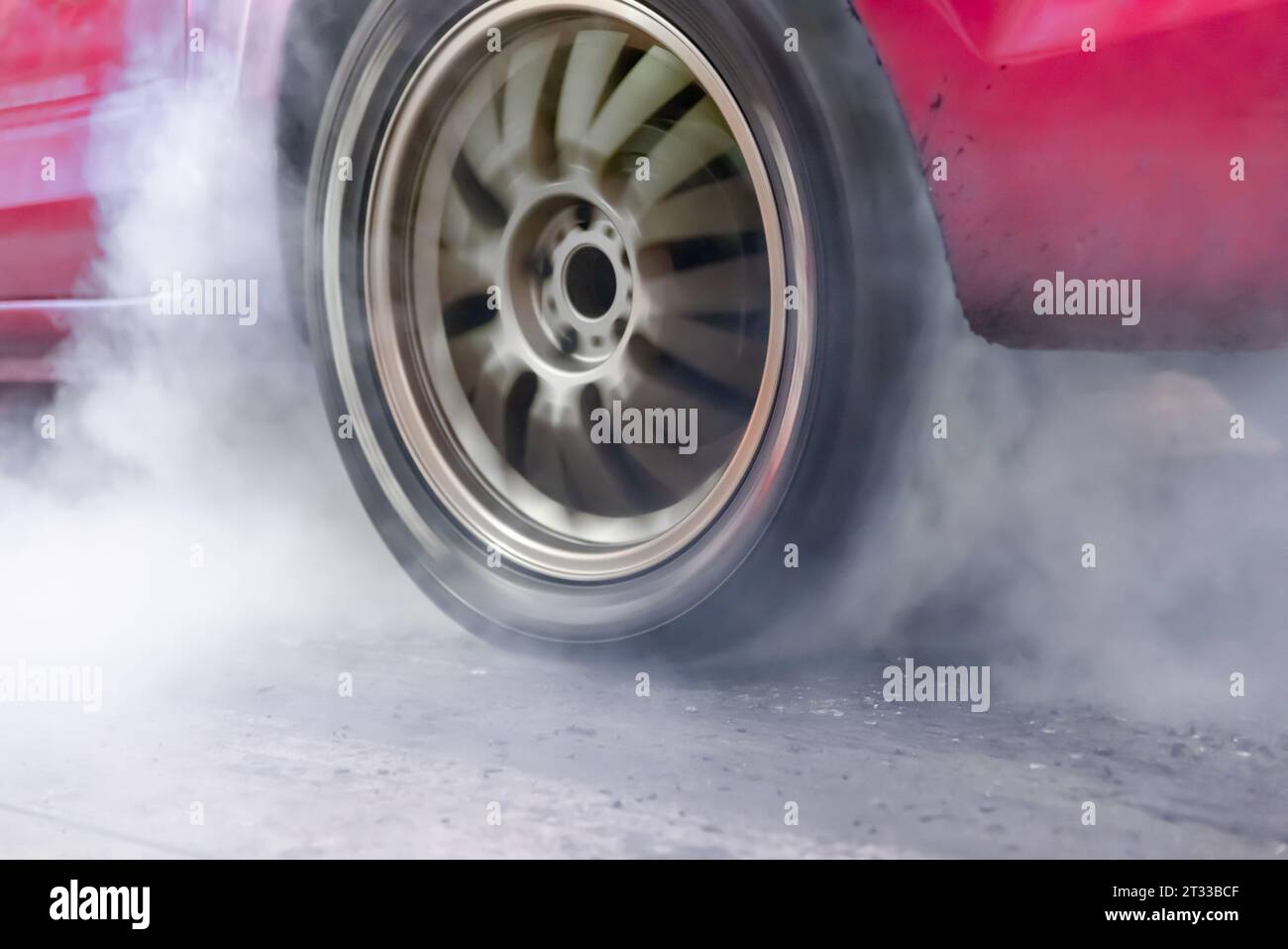 Drag racing car burning tire at starting line in race track Stock Photo ...