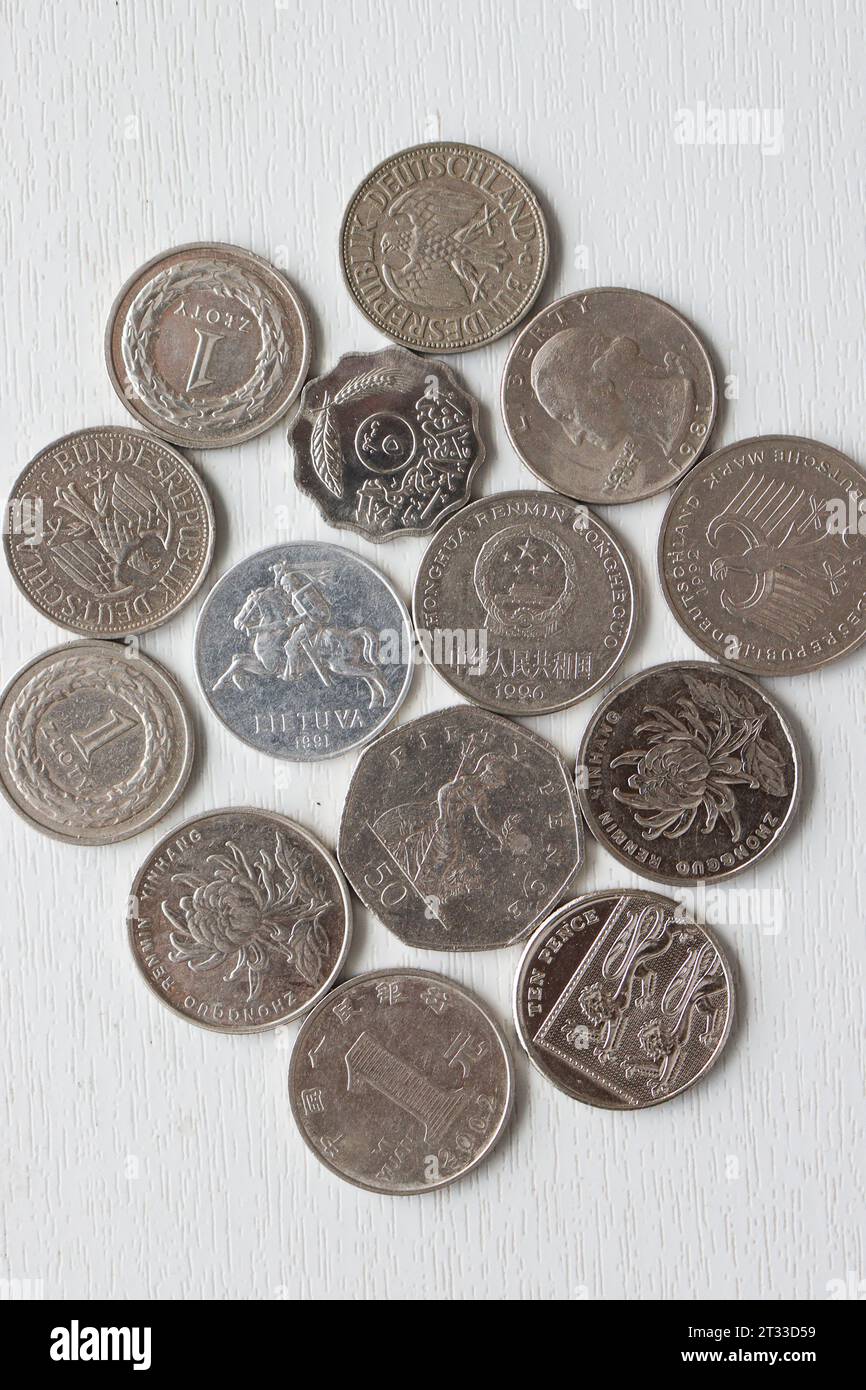 Vertical photo of white coins Stock Photo - Alamy