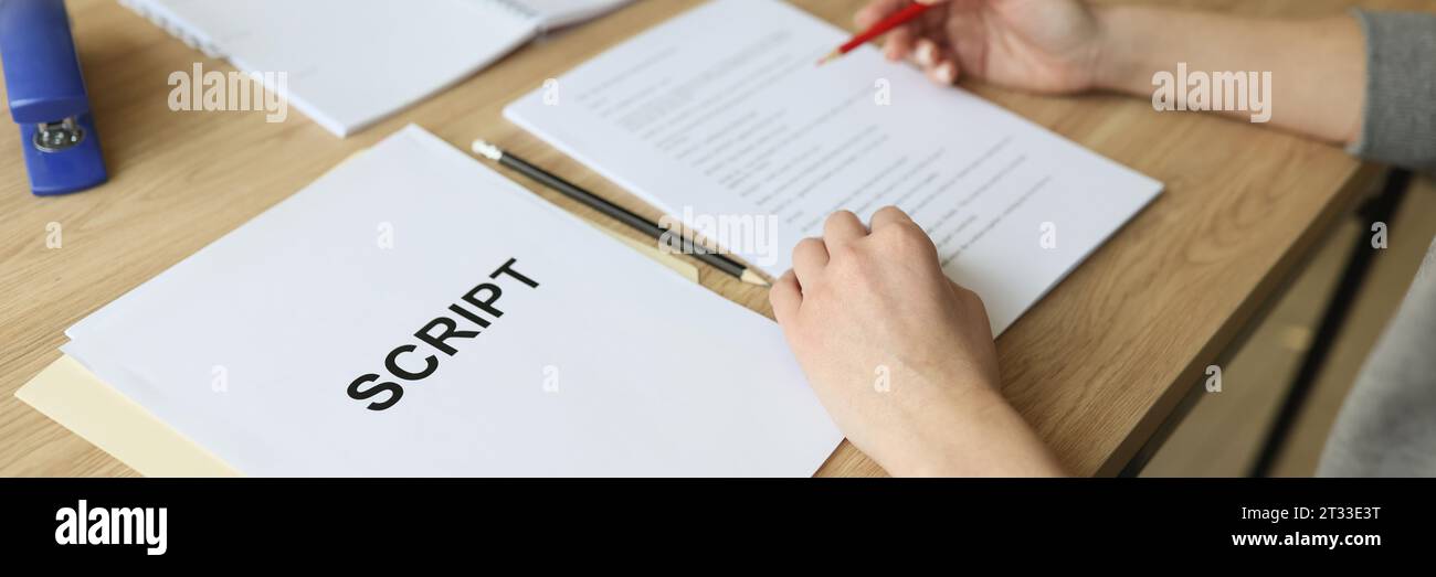 Actress checks script papers making notes with pencil Stock Photo - Alamy