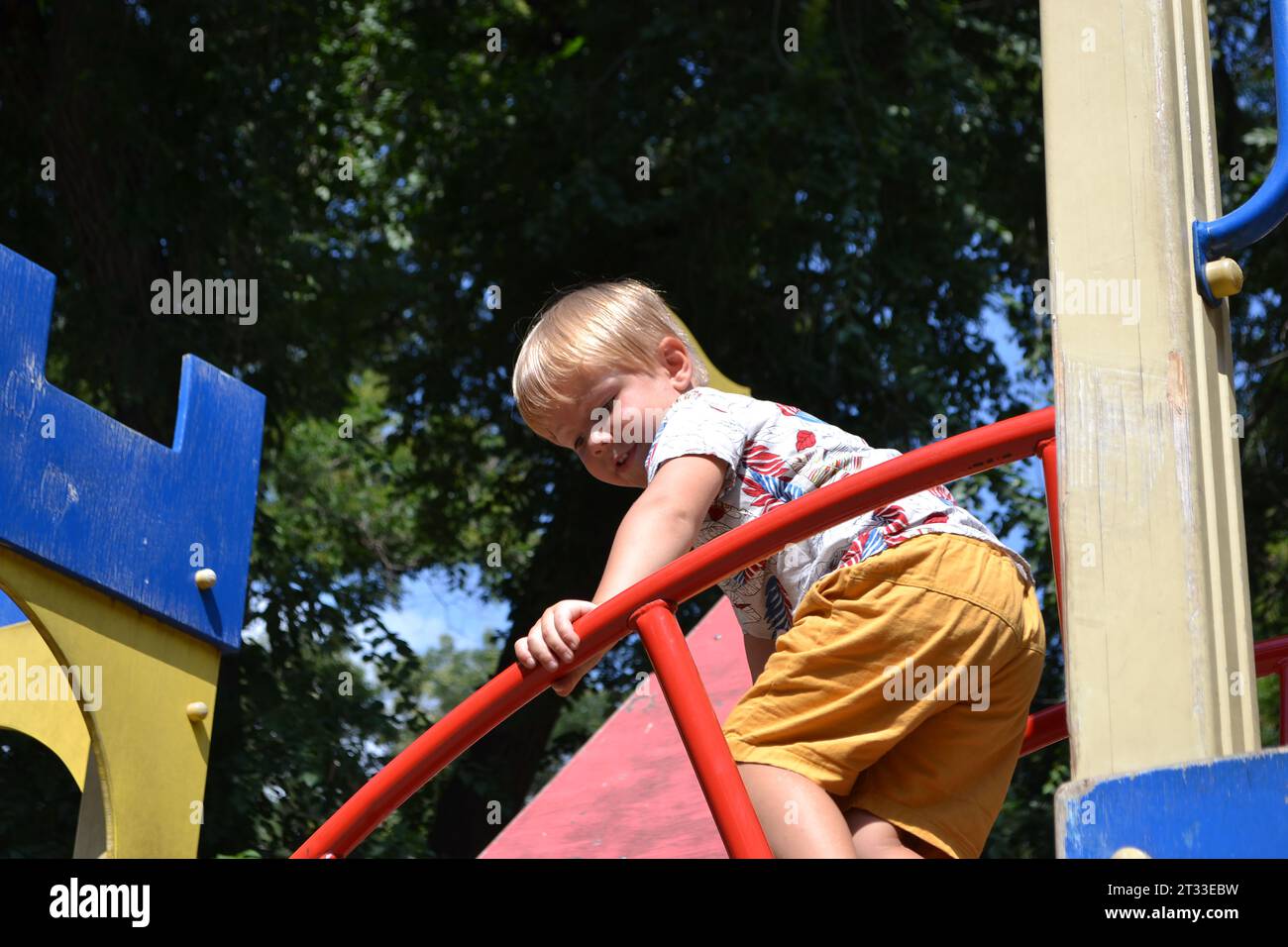 Little children run around and play in the playground. Game center for ...