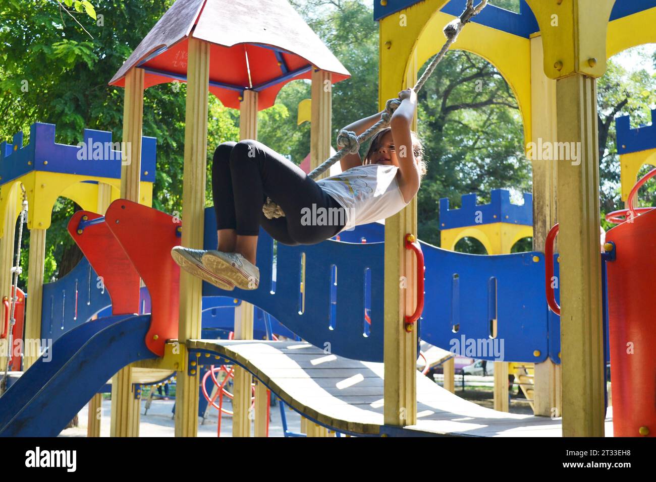 Little children run around and play in the playground. Game center for ...