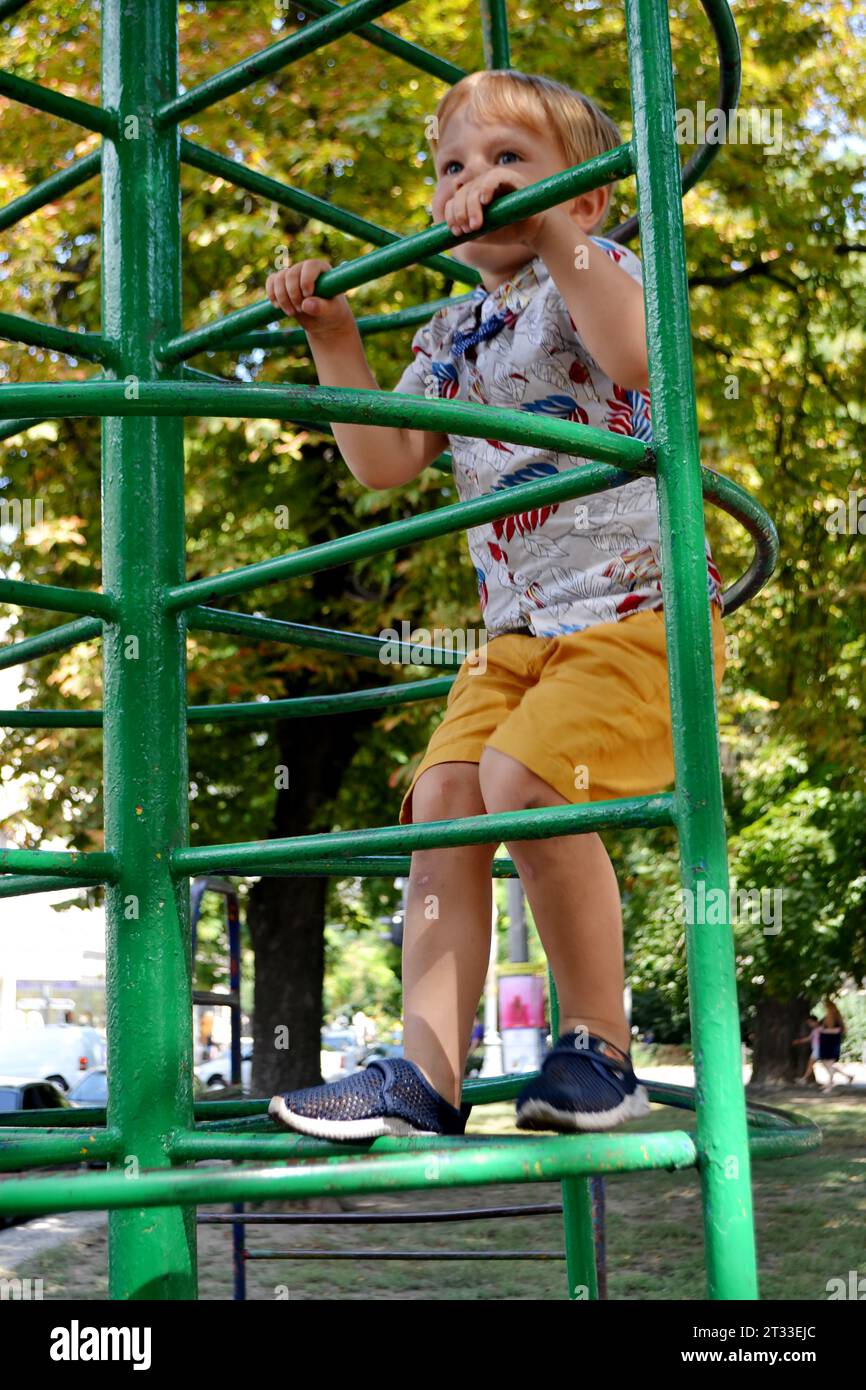 Little children run around and play in the playground. Game center for ...