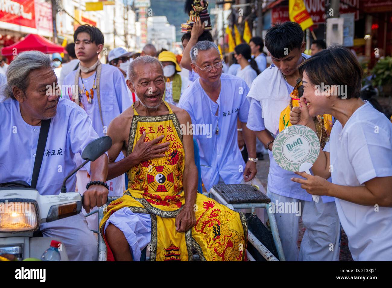 A smiling Thai man is welcomed by onlookers at the annual Phuket ...