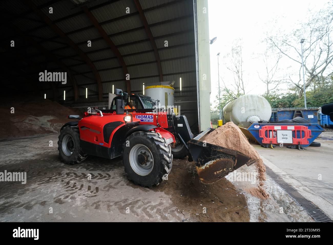 National Highways staff load a winter service vehicle with salt at ...