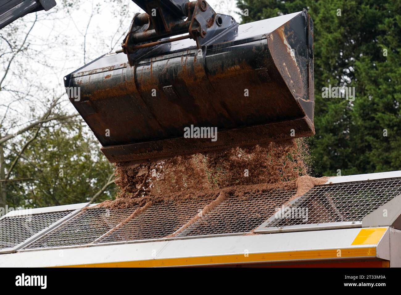 National Highways staff load a winter service vehicle with salt at ...
