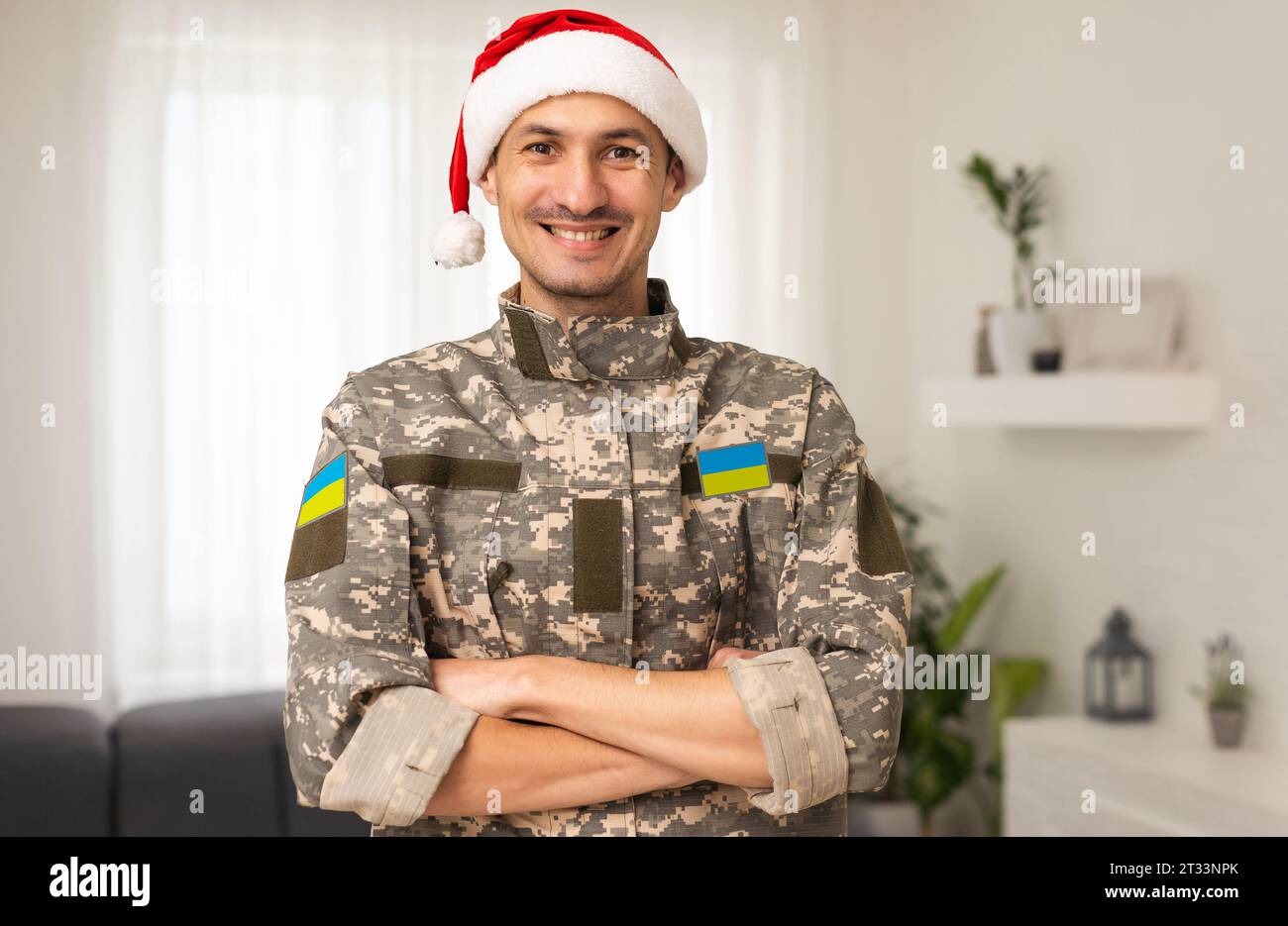 Ukrainian military man with a Santa hat Stock Photo - Alamy