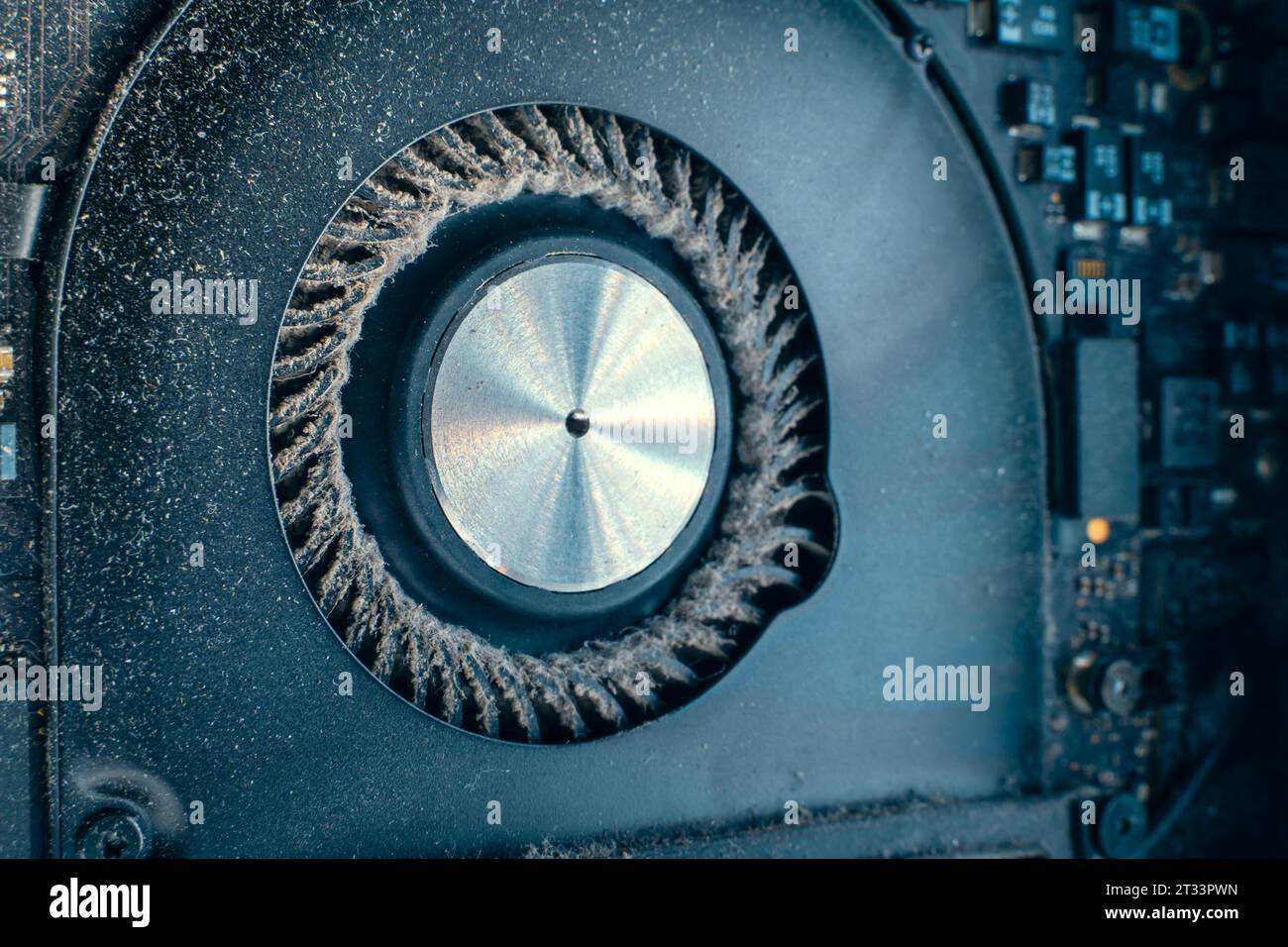 Close-up of dust lumps in a laptop cooling cooler. Fan inside a dusty ...