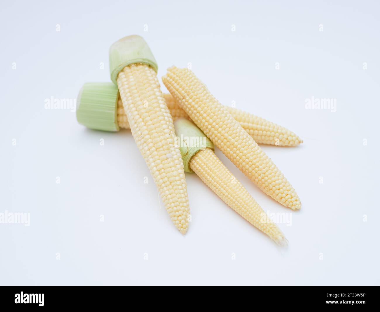 peeled baby corn isolated on white background Stock Photo - Alamy