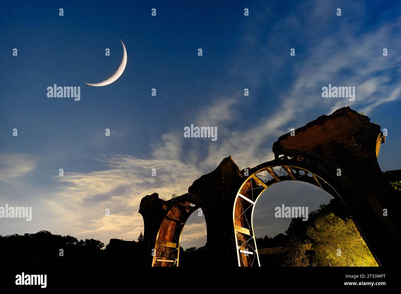 The crescent moon on an autumn night looks unobtrusive and unobtrusive ...