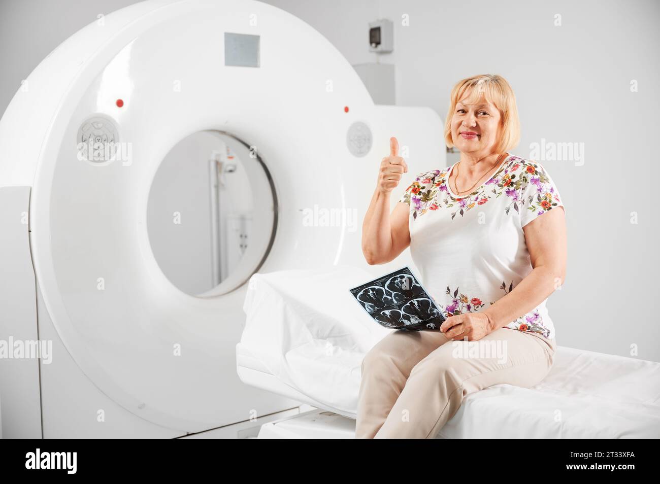Medical computed tomography or MRI scanner. Portrait of female patient ...