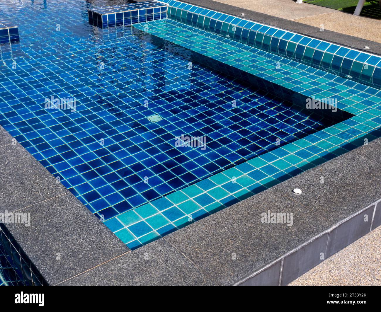 Floating bench seat, sitting zone in swimming pool with clean clear ...