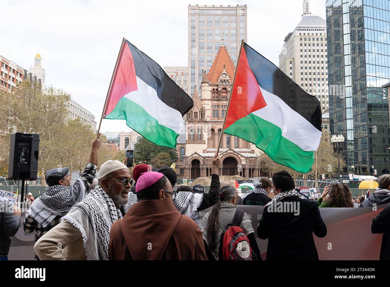 Two men wave Palestinian flags while religious leaders meet on the ...