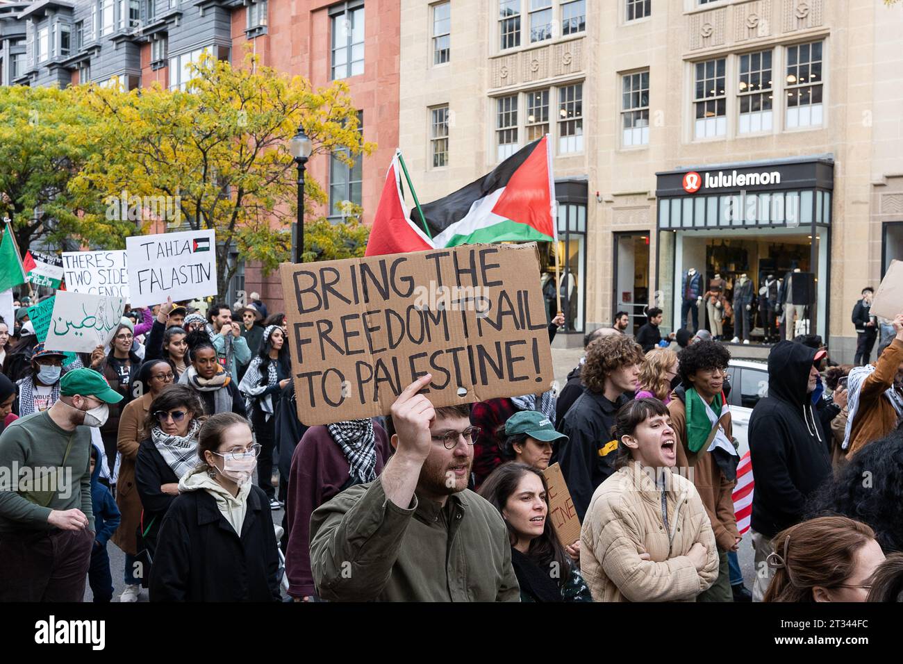 Pro-Palestine protesters with placards march through Boston's Back Bay ...