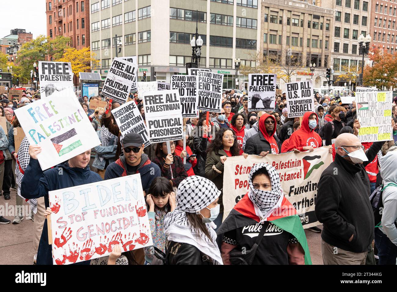 Pro-Palestine protesters hold signs while listening to speakers at the ...