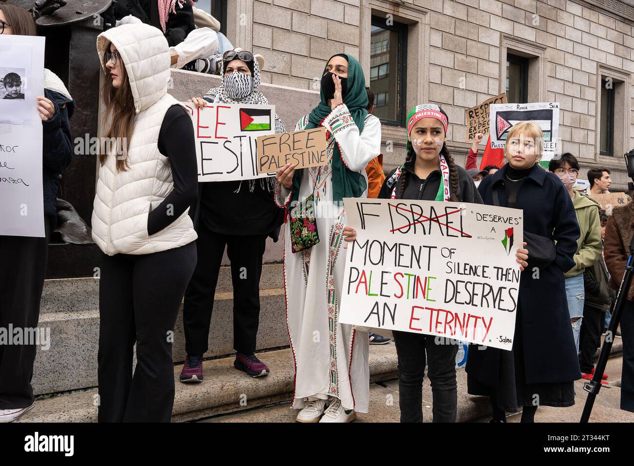 Pro-Palestine protesters hold signs while listening to speakers at the ...