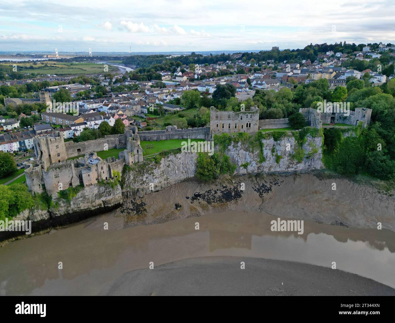 Aerial drone view of Chepstow Castle and the River Wye, with the town ...