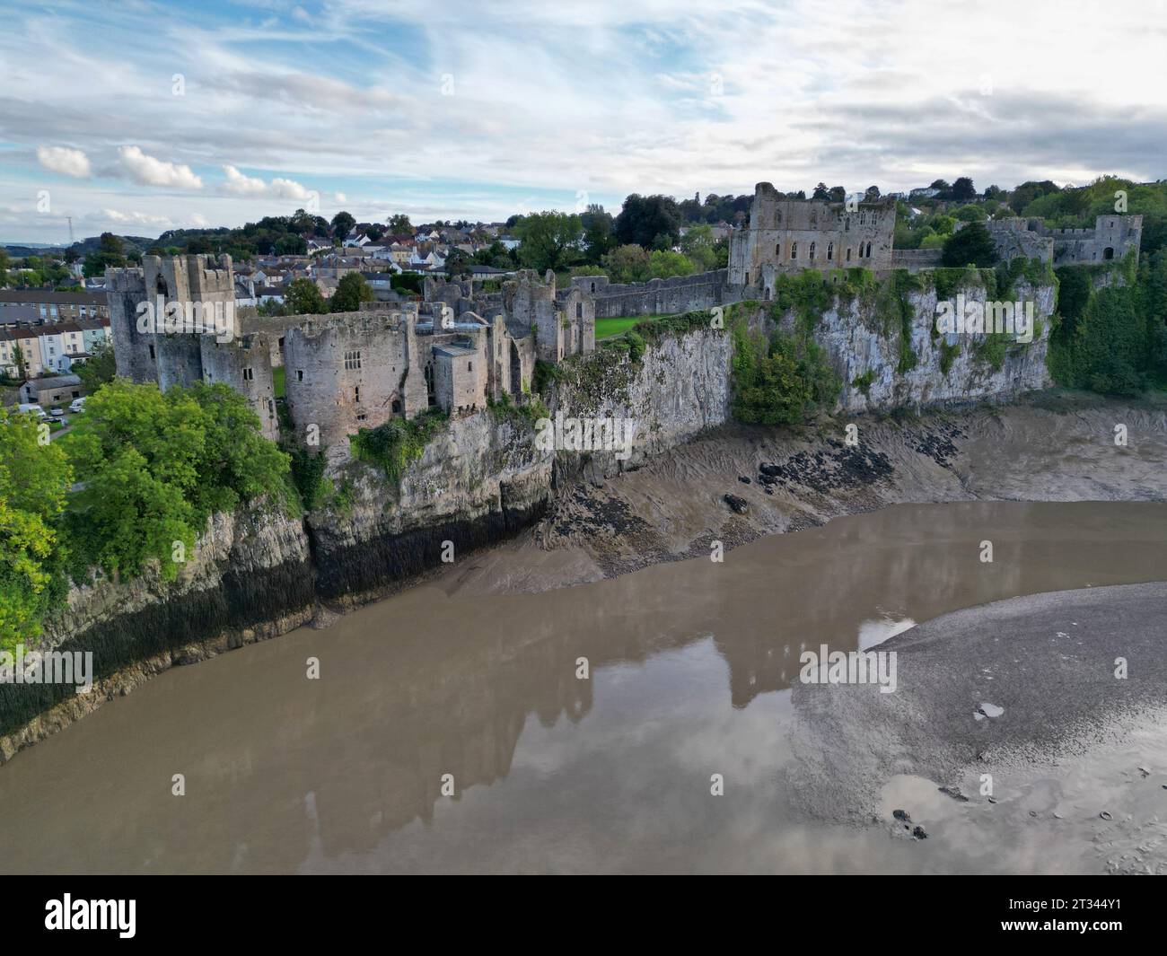 Aerial drone view of Chepstow Castle and the River Wye, with the town ...