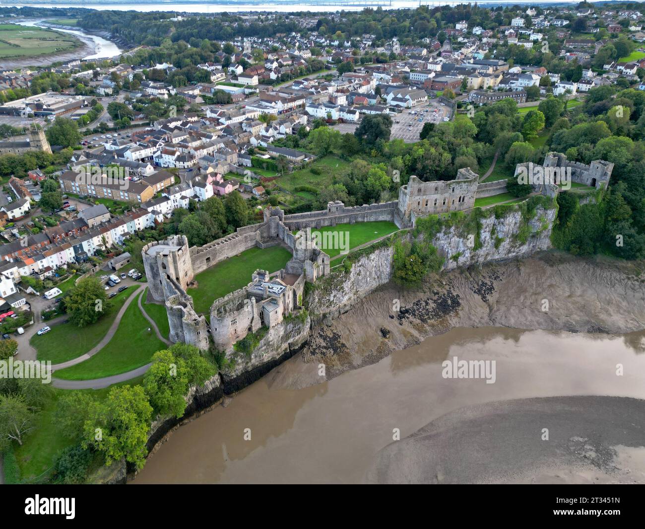 Aerial drone view of Chepstow Castle and the River Wye, with the town ...
