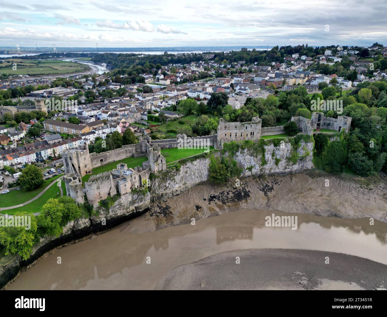 Aerial drone view of Chepstow Castle and the River Wye, with the town ...