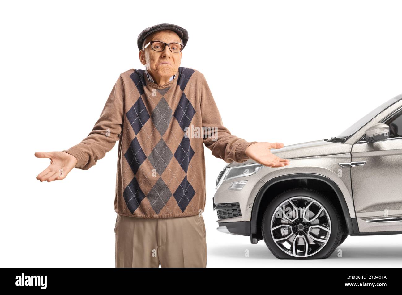 Confused elderly man standing in front of a SUV with a flat tire ...