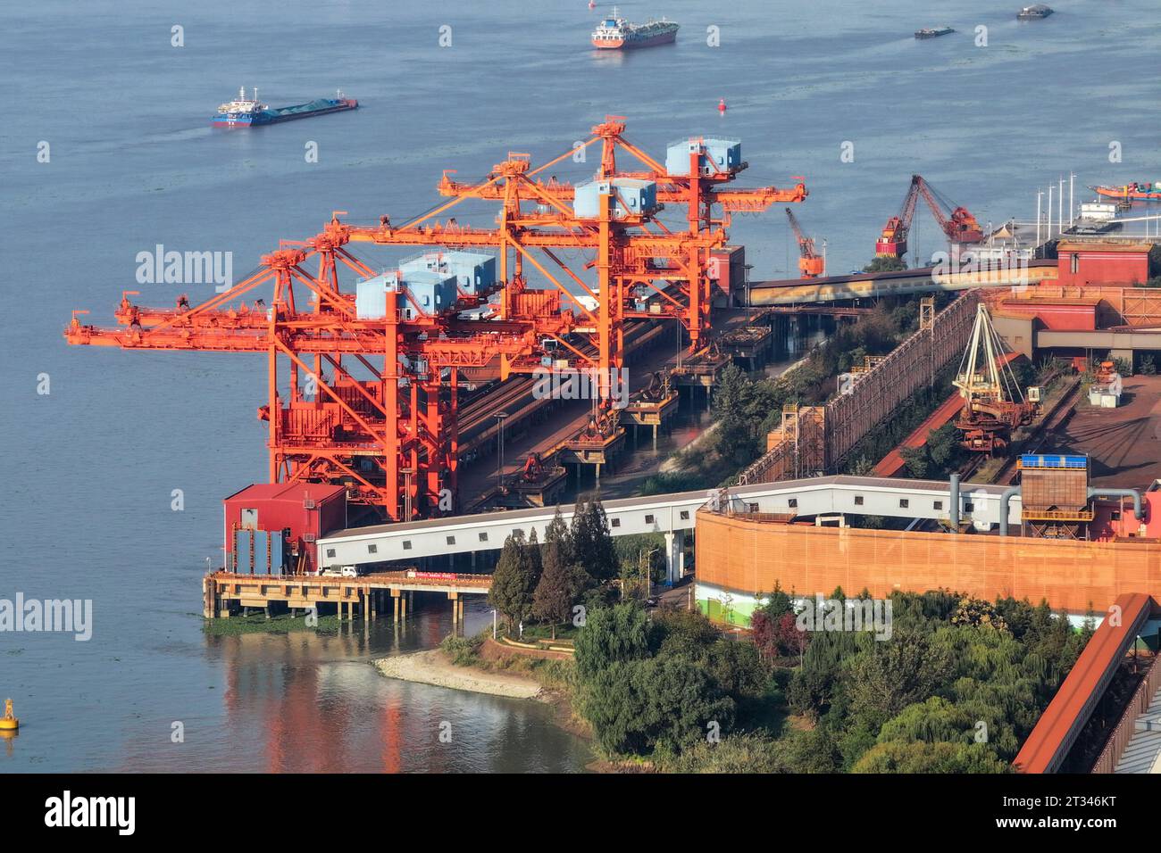 NANJING, CHINA - OCTOBER 23, 2023 - Cargo ships dock at Meishan Iron ...