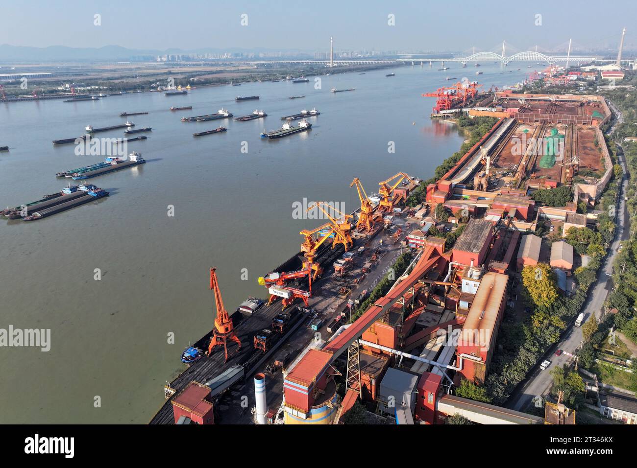 NANJING, CHINA - OCTOBER 23, 2023 - Cargo ships dock at Meishan Iron ...