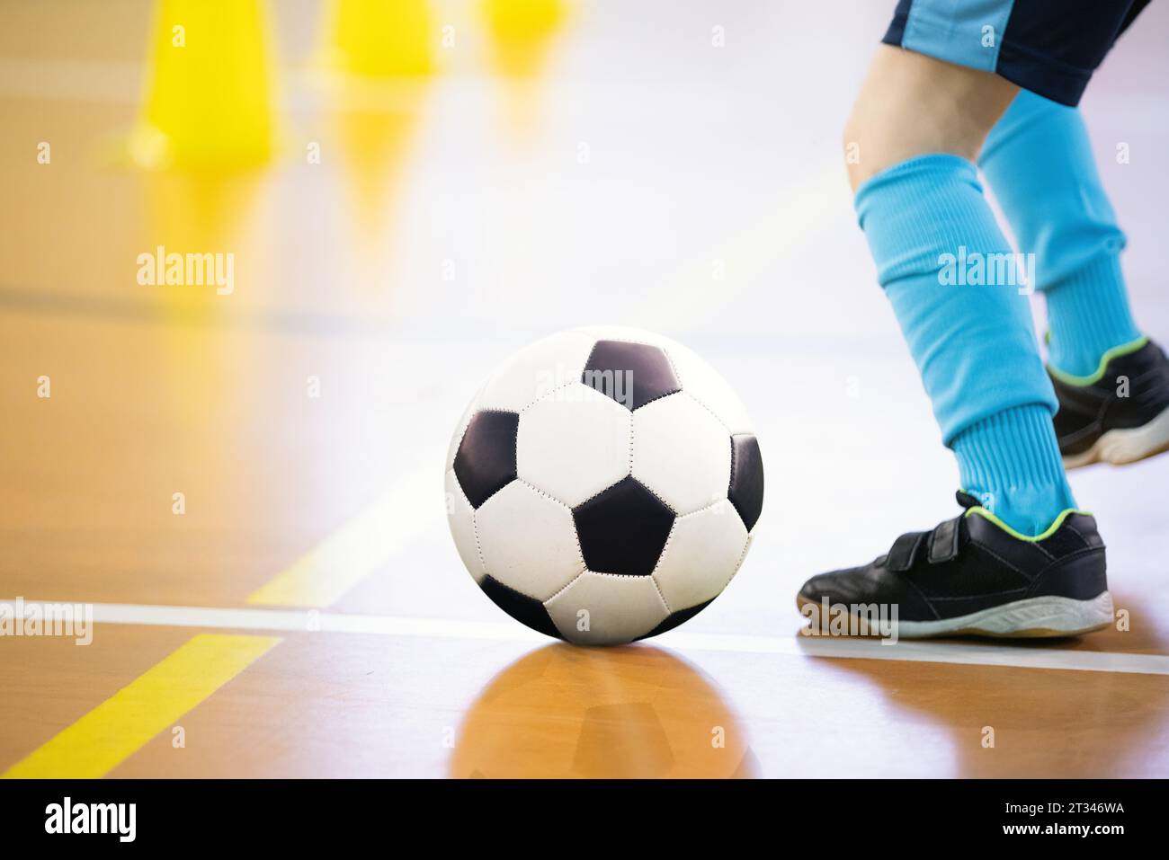 Futsal player kicking soccer ball. Soccer training dribbling drill ...