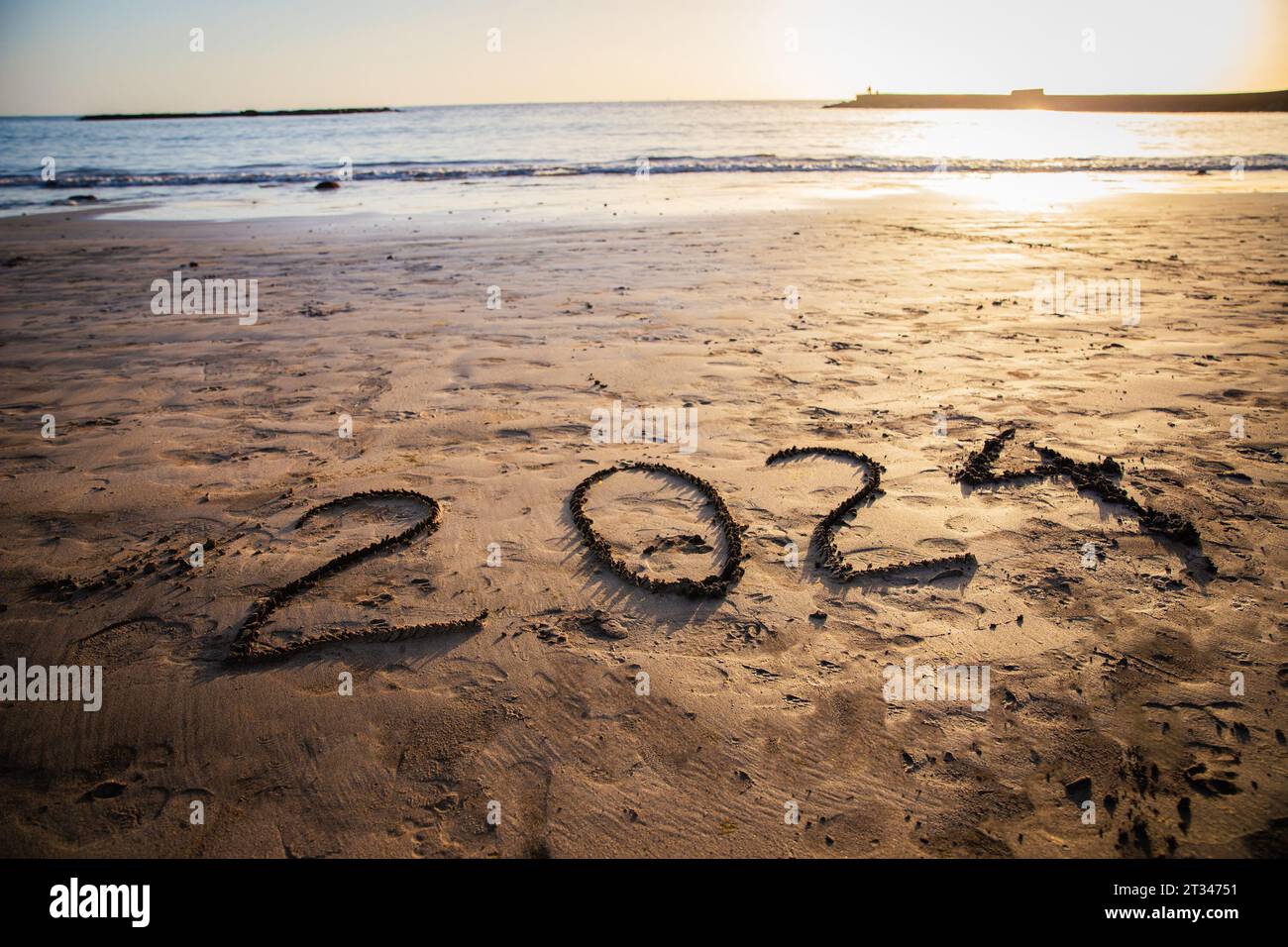 2024 written on the beach during sunset, new year photo. Picture with ...