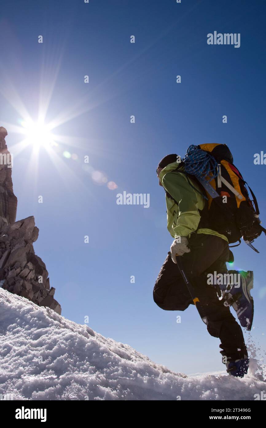 Hiking towards sun on snowy hi-res stock photography and images - Alamy