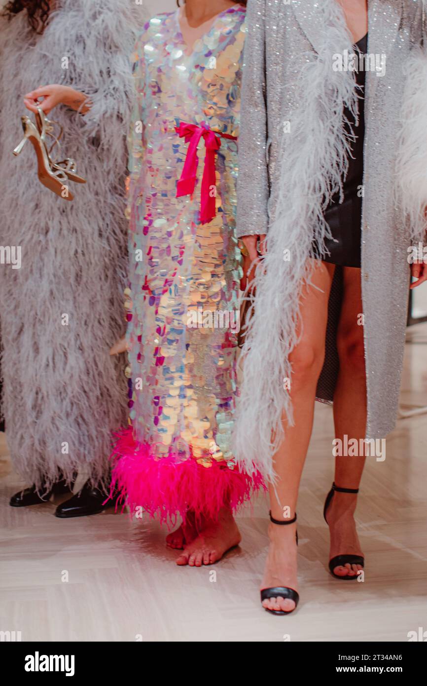Silhouettes of fashion models on backstage dressed in a long Haute ...