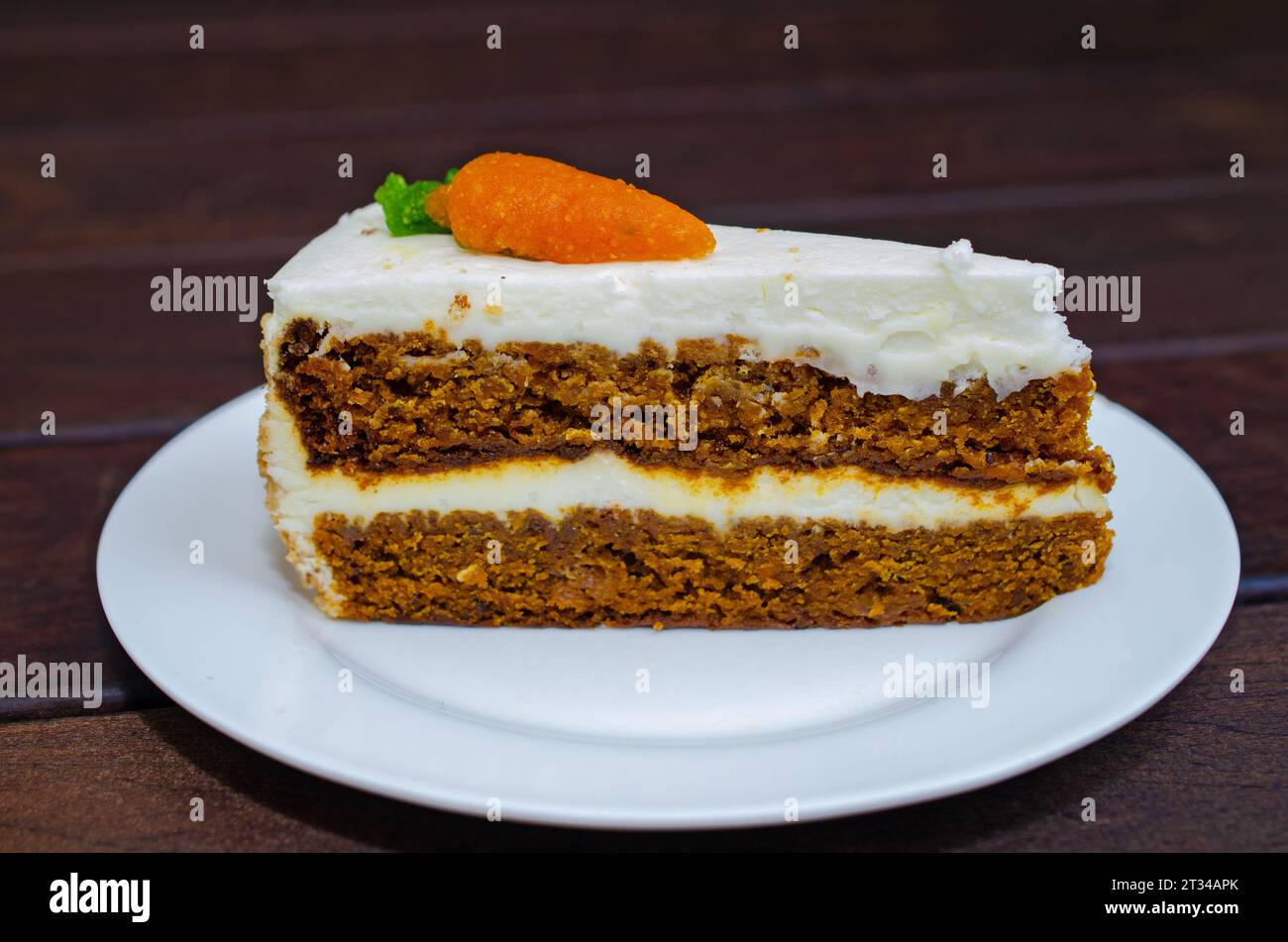 Carrot sponge cake with cream and walnuts Stock Photo - Alamy