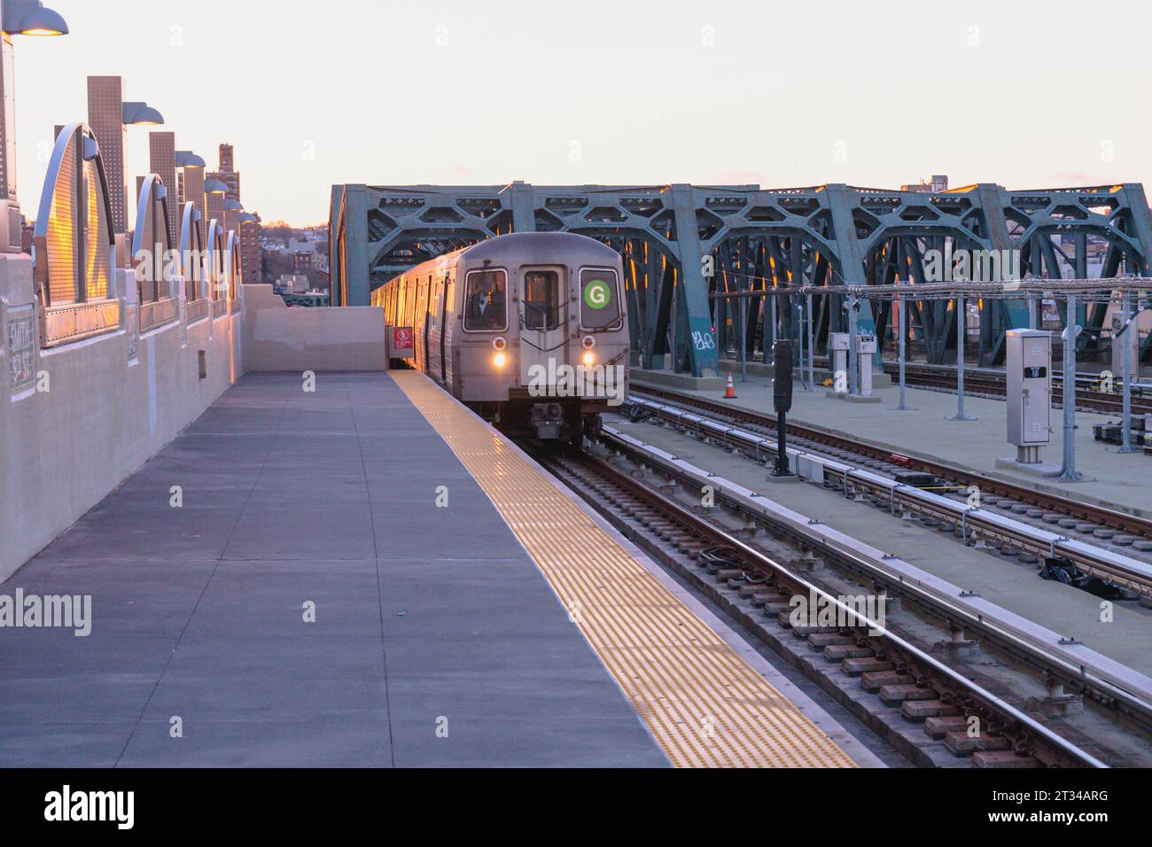 G Train arrives at the Smith Street station in Brooklyn at sunrise ...