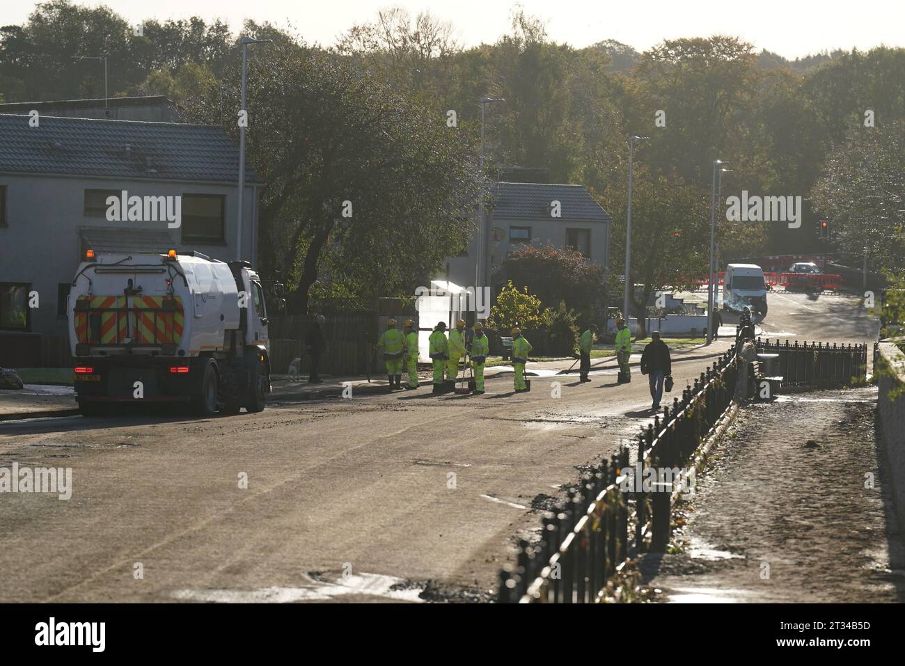 Local authority workers clean up the debris left in the aftermath of ...