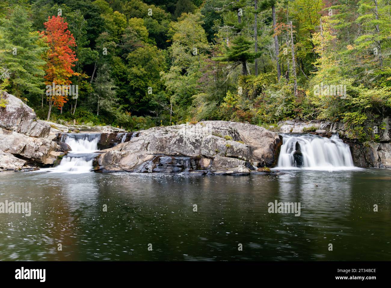 Two Smooth Waterfalls Pour Water Bellow Surrounded by Greenery Stock ...