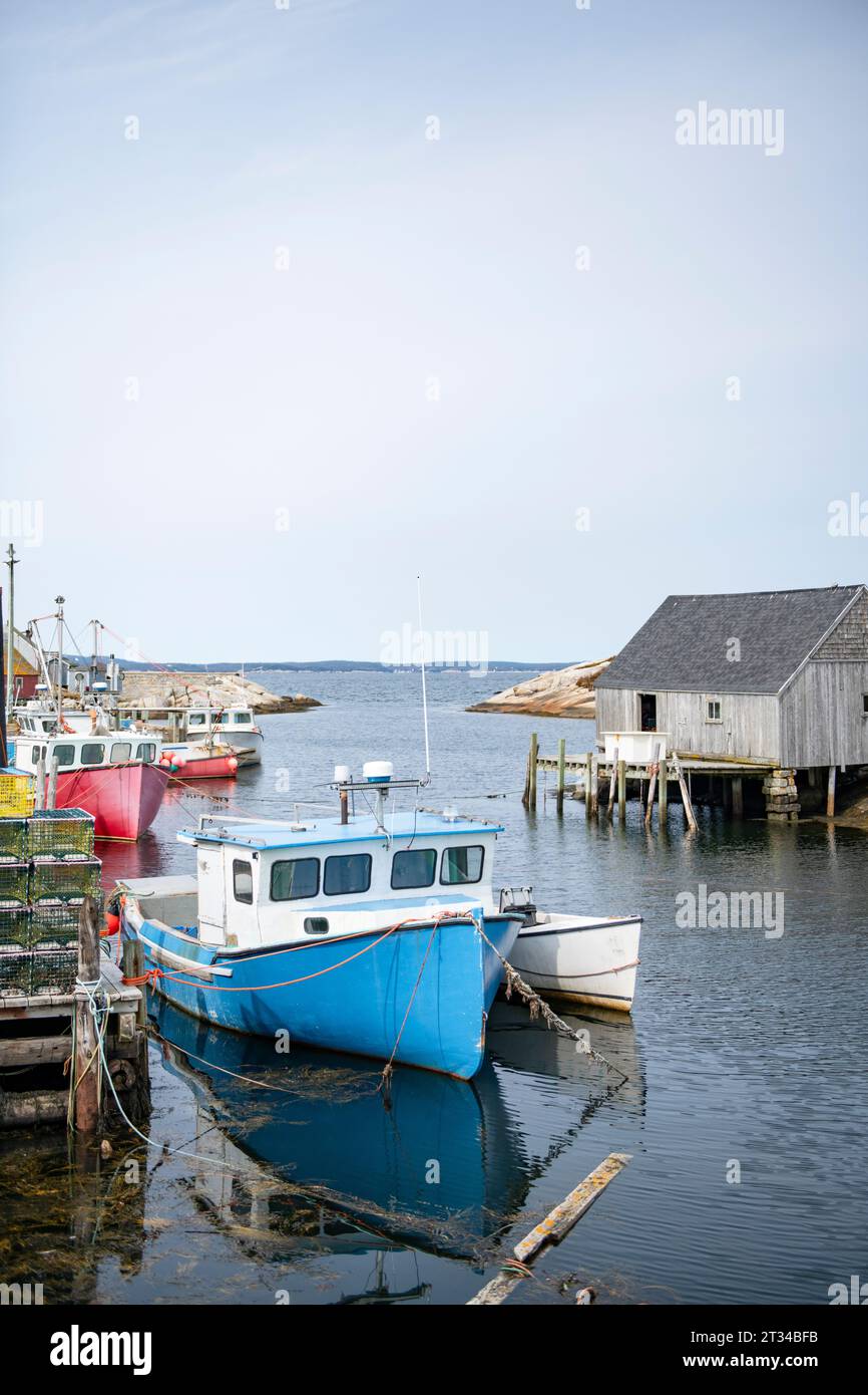 Fishing Boats at dock in iconic Peggy's Cove of Nova Scotia Stock Photo ...
