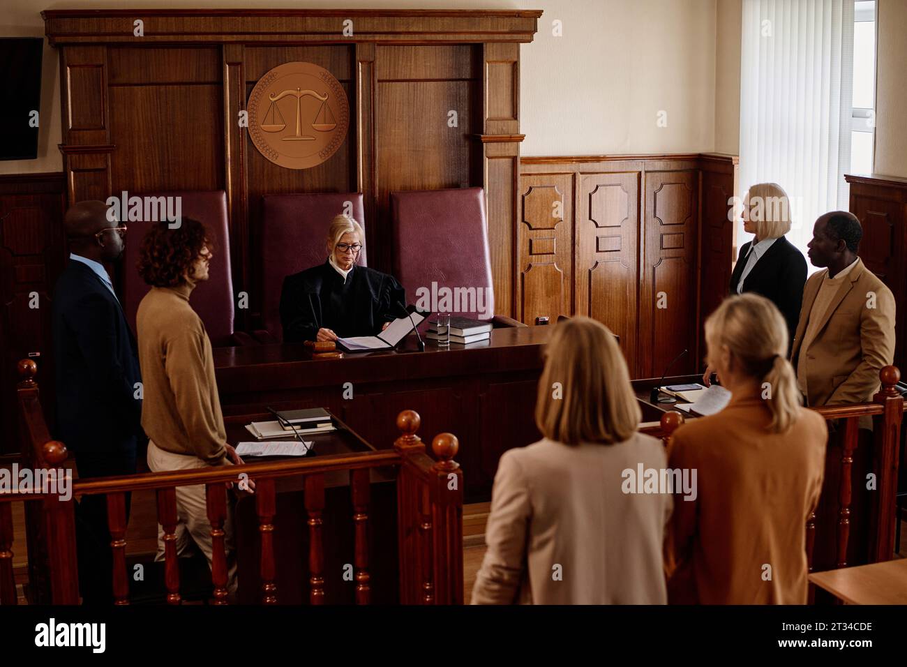 Group of witnesses, attorneys, lawyers, prosecutor and suspect standing ...