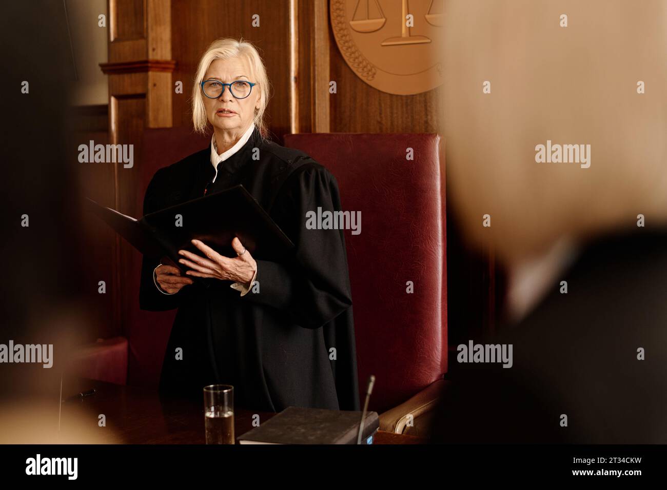 Woman judge in black robe hi-res stock photography and images - Alamy