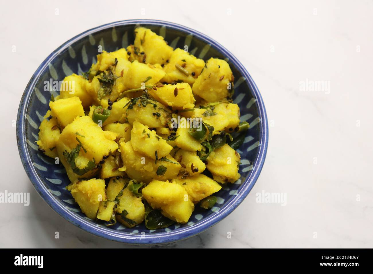Indian boiled mashed potatoes curry or sabzi. Alu ki sukhi sabzi. Also ...