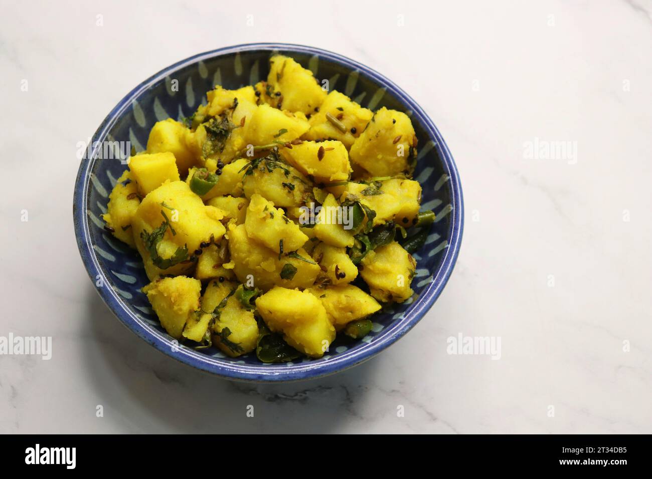 Indian boiled mashed potatoes curry or sabzi. Alu ki sukhi sabzi. Also ...