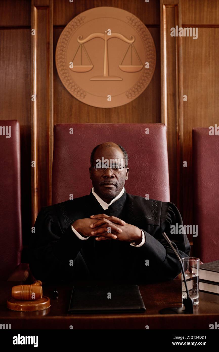 Mature male judge sitting hi-res stock photography and images - Alamy