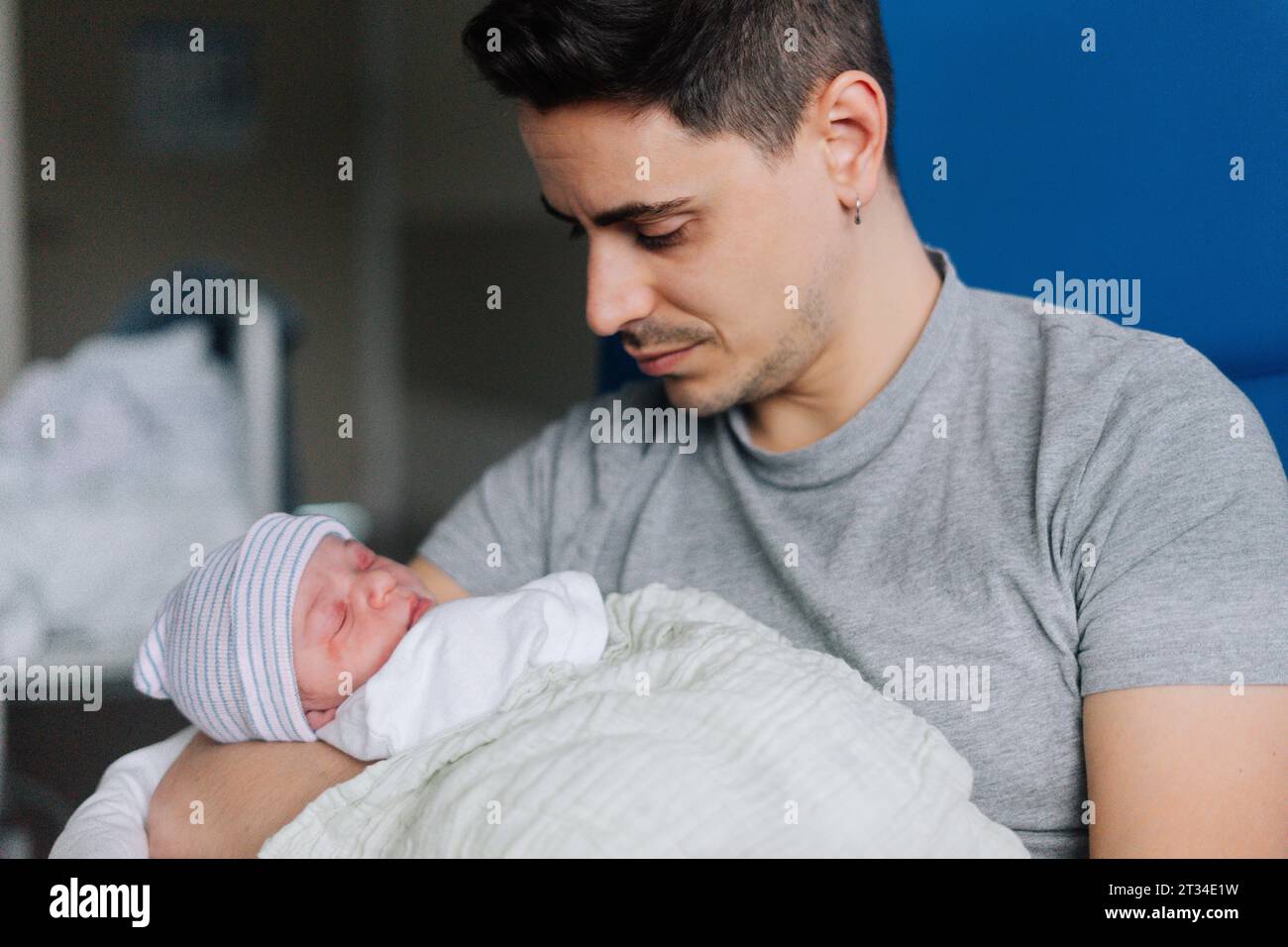 Portrait of a father with his one day old firstborn baby Stock Photo ...