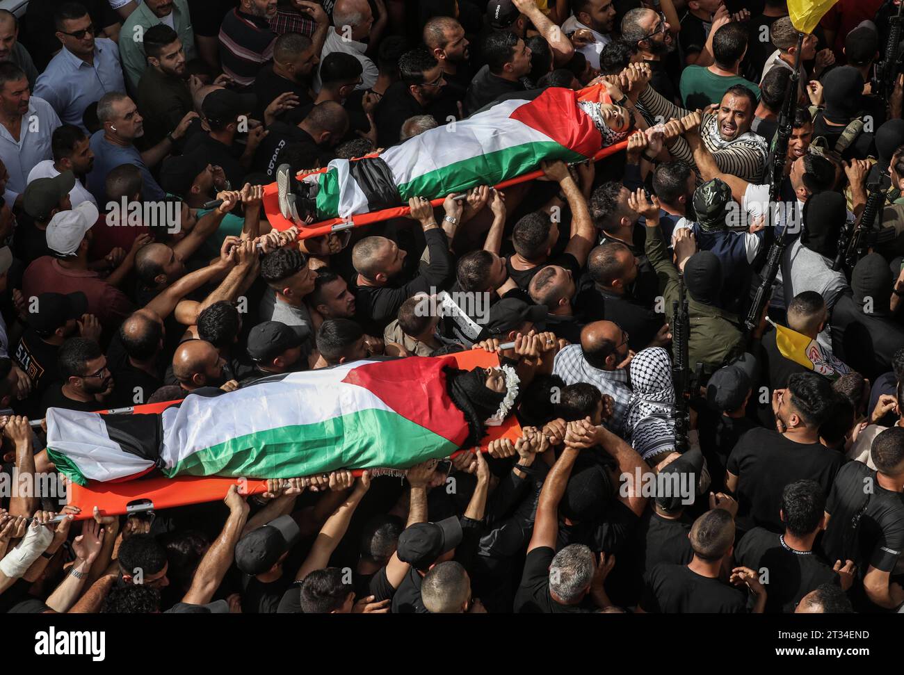 Zawata, Palestinian Territories. 23rd Oct, 2023. Palestinians hold the ...