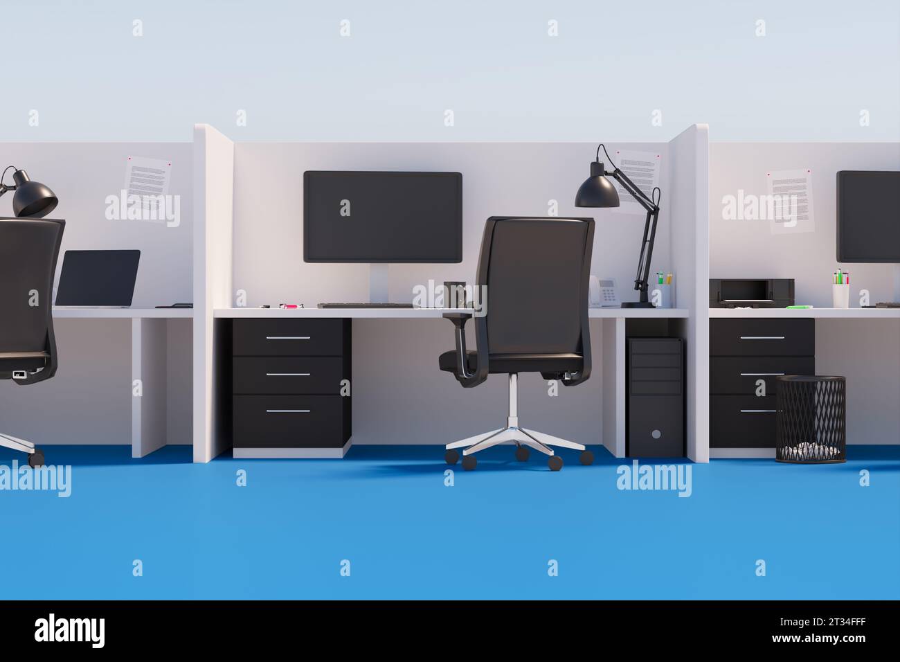 Front view of cubicles with tables, chairs, and computers in a modern office building. A white ...