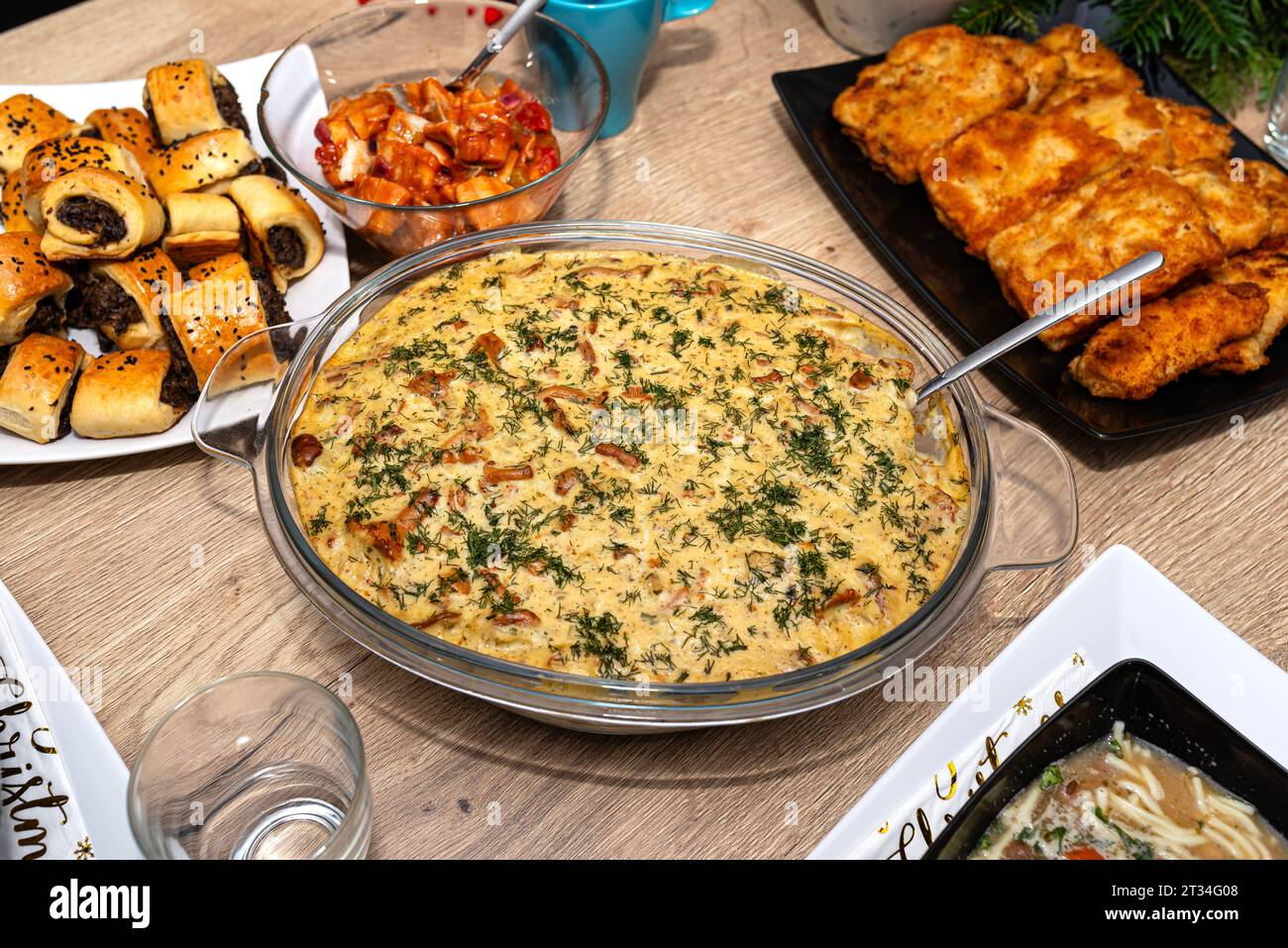 The table is set before Christmas dinner in Poland, visible baked cod ...
