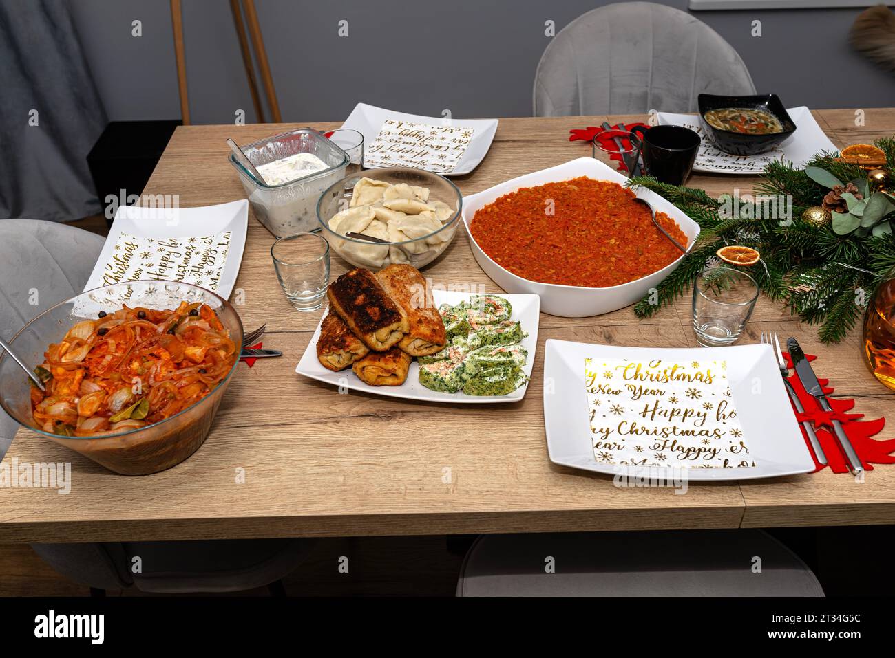 A table set before Christmas dinner in Poland, visible croquettes and a ...