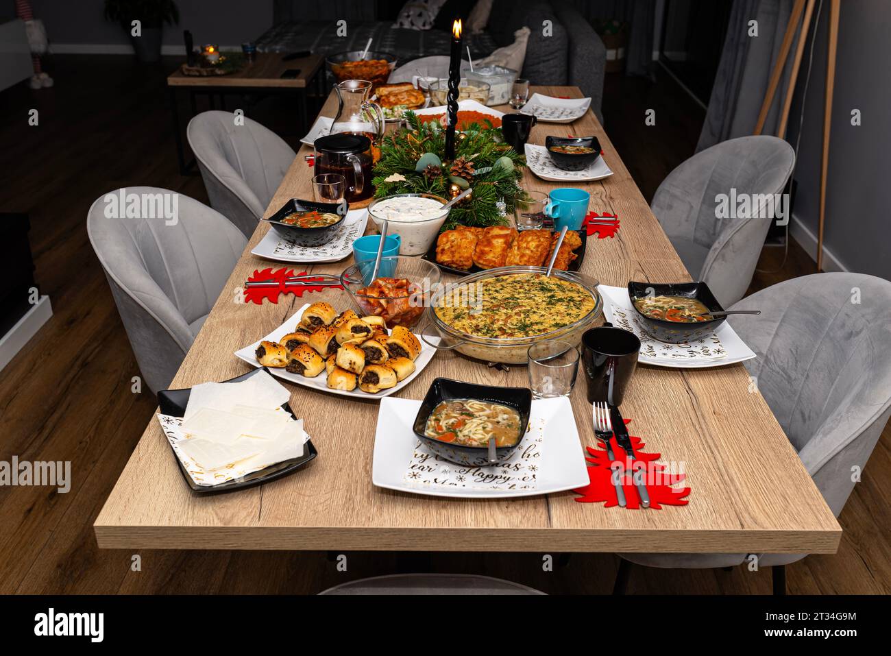 A table set before Christmas dinner with many traditional Polish dishes ...
