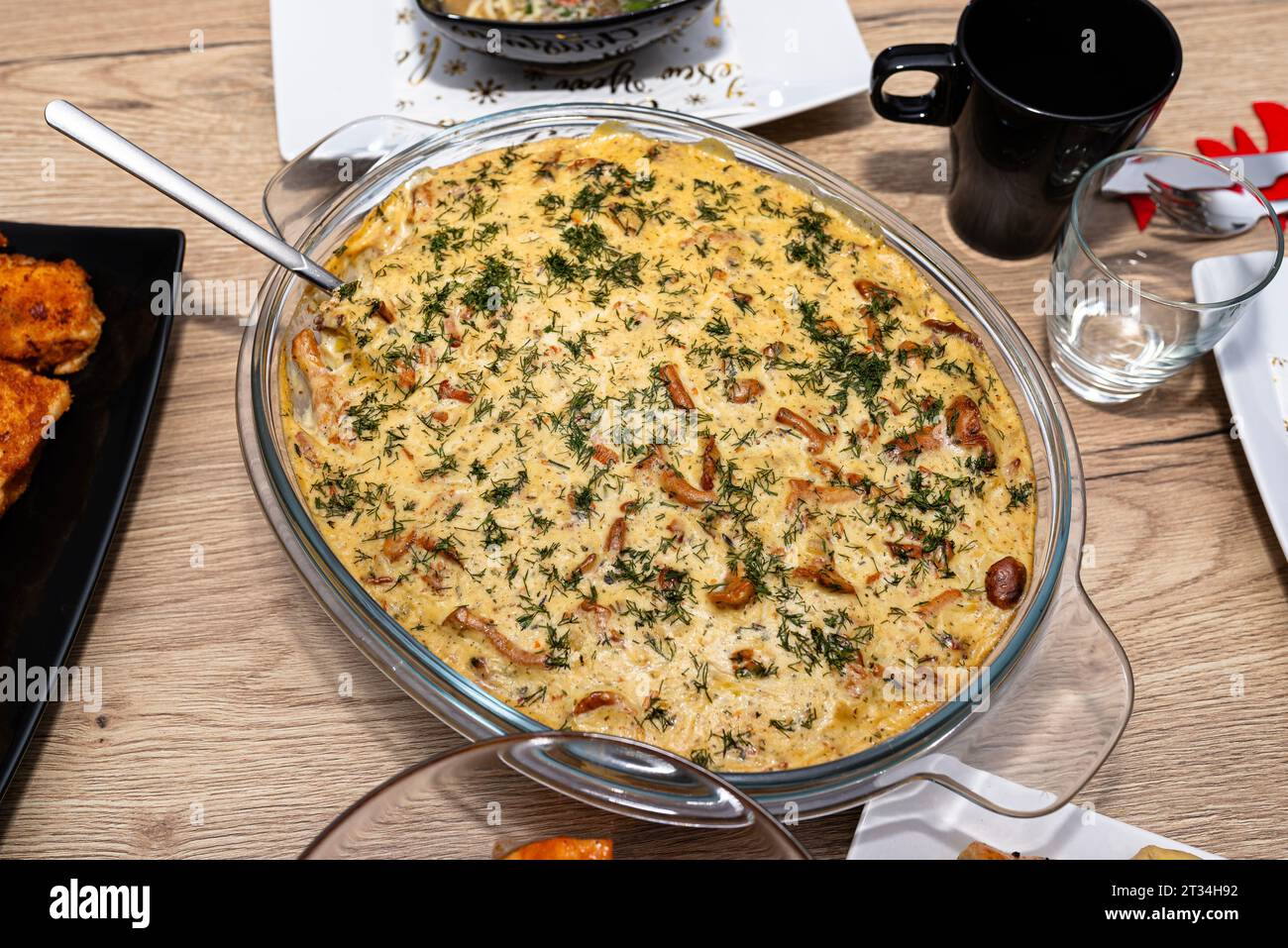 The table is set before Christmas dinner in Poland, visible baked cod ...