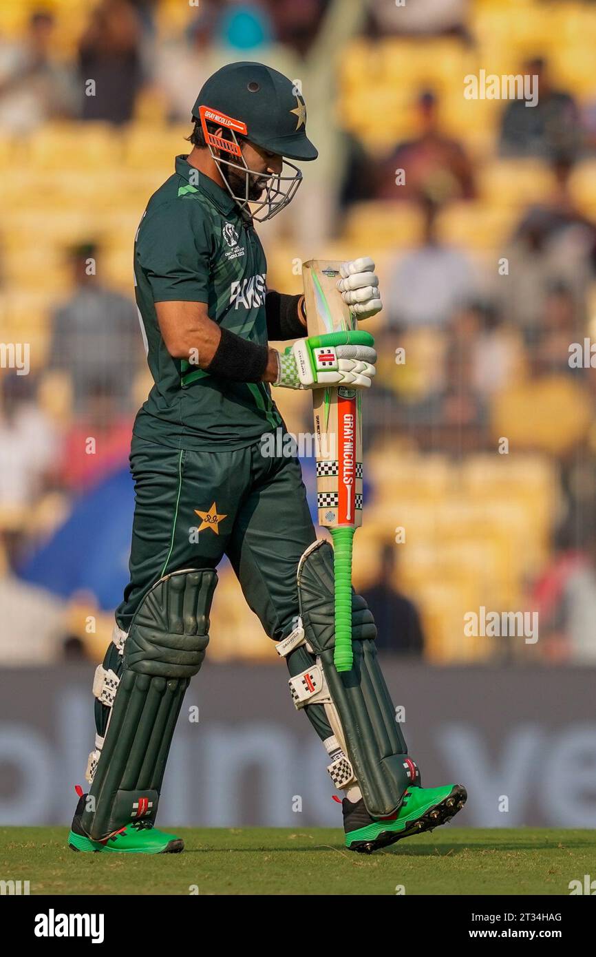 Pakistan's Mohammad Rizwan looks at his bat as he leaves the ground ...
